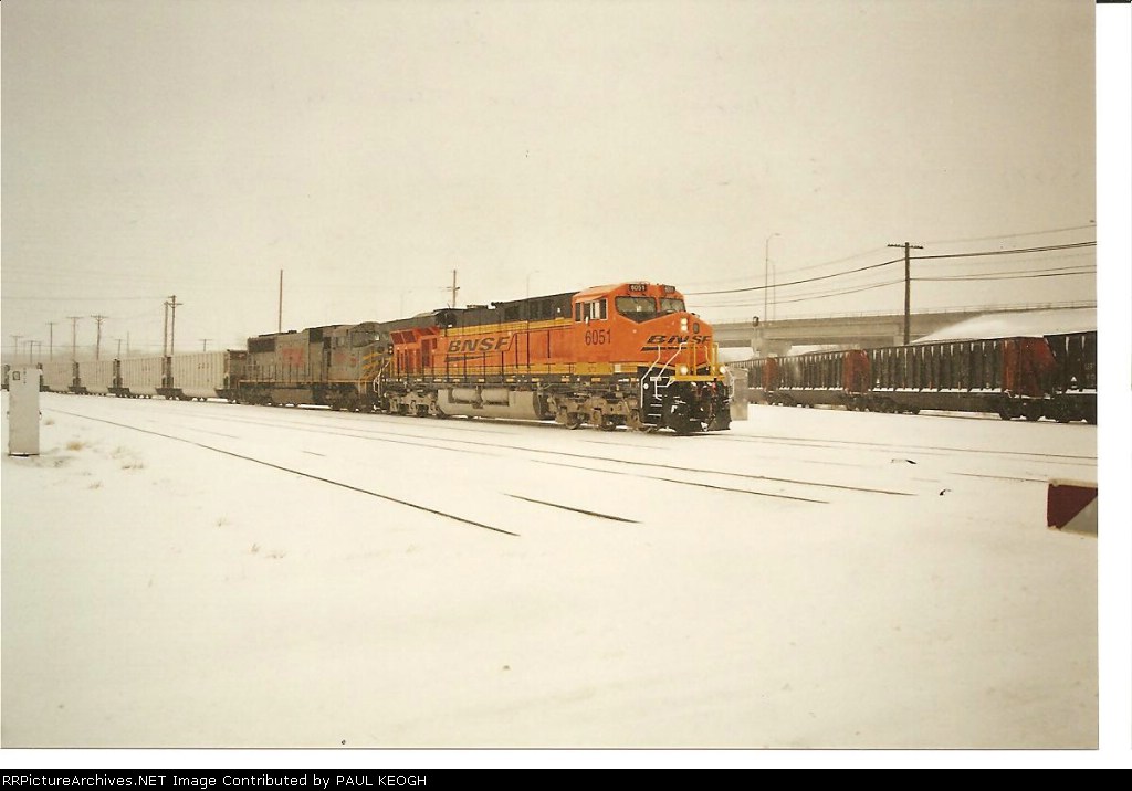 BNSF 6051 and a TFM SD-70M roll north into Carlin Junction, NE.
